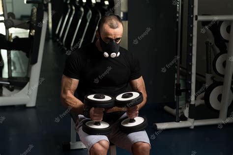 Premium Photo Biceps Exercise With Dumbbells In Elevation Mask