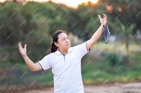 Premium Photo Asian Man Take Off Mask And Rise His Hand Up In Golden