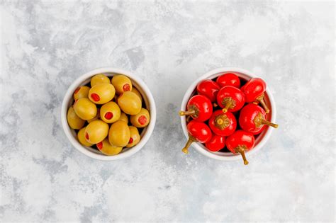 Free Photo Pickled Small Round Red Hot Cherry Chili Peppers On Grey