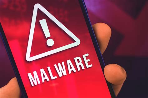 Premium Photo Man Hold Mobile Phone With Malware Warn Screen Concept