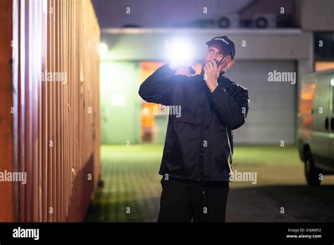 Security Guard At Cargo Container Storage Terminal At Night Stock Photo Alamy