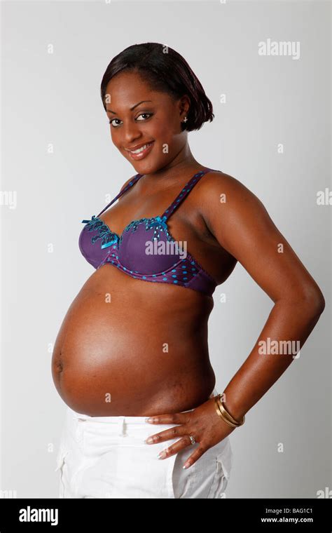 Pretty Black Girl Heavily Pregnant Showing Off Her Belly Stock Photo