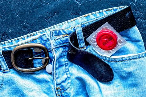 Concept Male Contraception Condom In Jeans Pocket Top View Stock Image