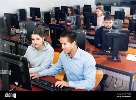 Computer Science Teacher Supervises The Execution Of A Programming Task