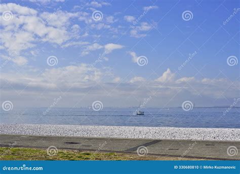 Osaka Bay During Sunset With Kansai International Airport In The