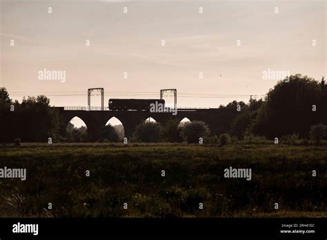 Sillhouette Of A Db Cargo Rail Uk Class 66 Locomotive 66063 Crossing