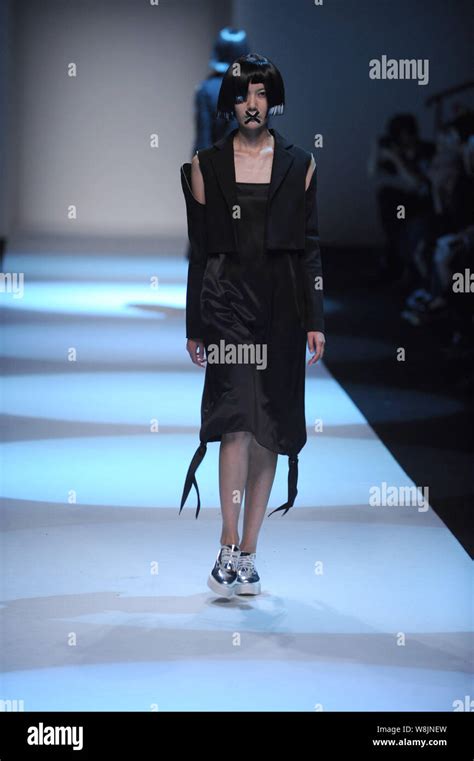 A Model Displays A New Creation At The Zhang Yuhao Fashion Show During The Shanghai Fashion Week