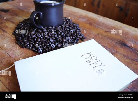 Cup Of Coffee Surrounded By Coffee Beans Hi Res Stock Photography And