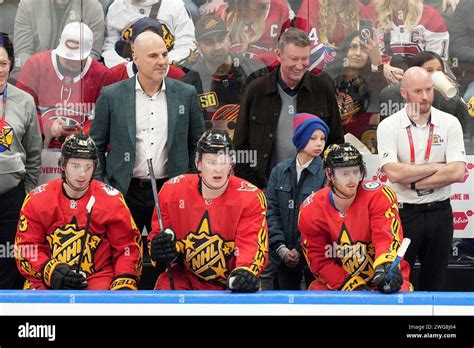 Team Hughes Coaches Rick Tocchet Rear Left And Wayne Gretzky Look On