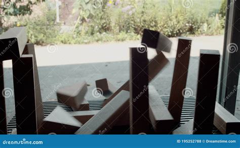 Collapsing Building Concept Simple Wooden Blocks Falling To Ground