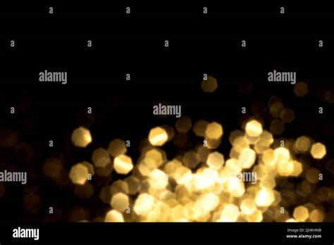 Golden Blurred Bokeh Lights On Black Background Glitter Sparkle Stars