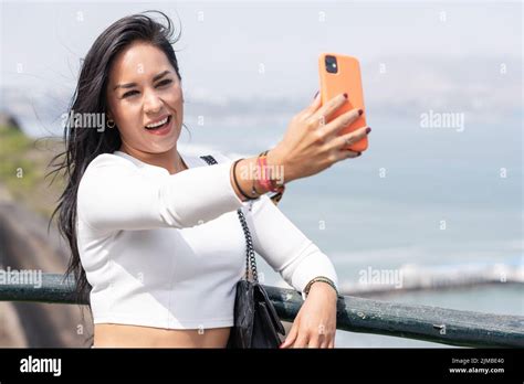 Beauty Brunette Woman Taking A Selfie With The Mobile In A View Point