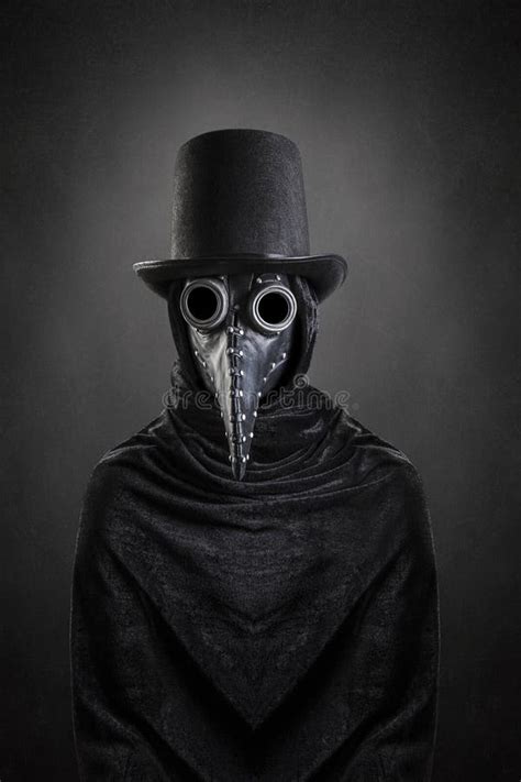 Plague Doctor With Black Vintage Top Hat At Night Over Dark Background