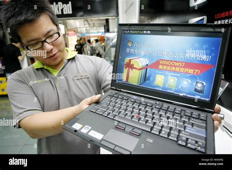 File A Chinese Man Shows A Laptop Computer Installed With Microsoft Windows Operating