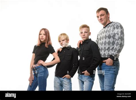 Dad Two Sons And A Daughter In Casual Clothes In Dark Colors White