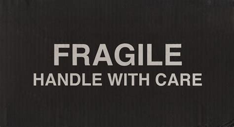 Premium Photo Fragile Sign On Black Corrugated Cardboard Box