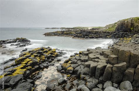 Black Basalt Columns Extending Out Into The Pacific Ocean On The