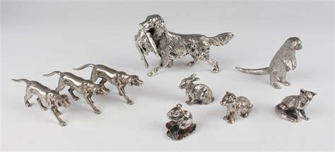 A Plated Model Of A Springer Spaniel Carrying A Fallen Rabbit In Its