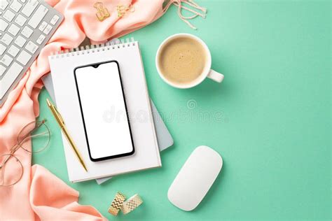 top view photo of smartphone notepad keyboard computer mouse cup of