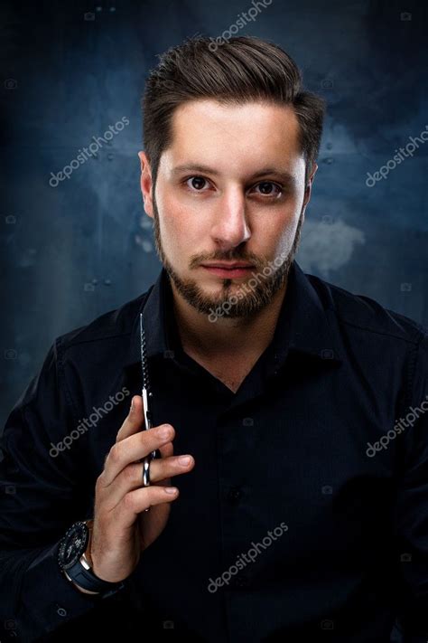 Man Holding Scissors Stock Photo Smmartynenko