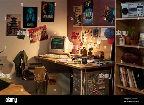 Retro Computer Setup On Desk Decorated With Vintage Posters Various