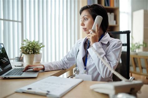 Premium Photo Physician Calling Patient