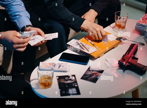Hands Of Cartel Kingpin Counting Money When Drug Dealer Snorting Line