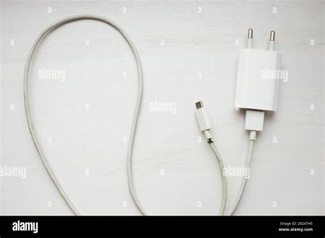 Electric Plug On White Background Broken Power Cord With Charger