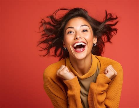 A Women Eyes Wide With Excitement Mouth Open In A Delighted Grin With Red Background Premium