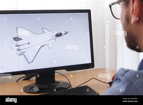 Engineer Constructor Designer In Glasses Working On A Personal Computer He Is Creating