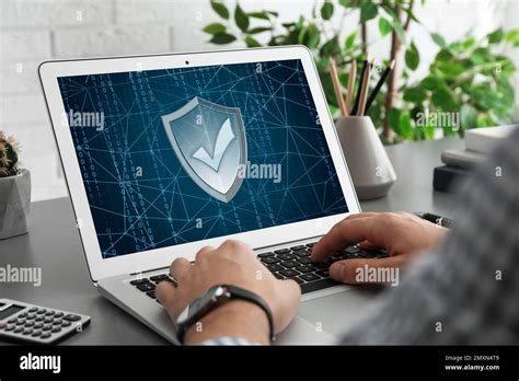 Cyber security concept. Man using application on laptop, closeup Stock Photo - Alamy