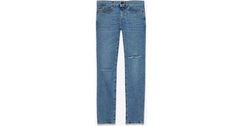Saint Laurent Low Waisted Ripped Skinny Jeans In Faded Blue Denim With