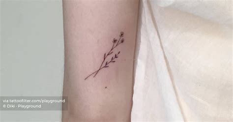 Minimalistic Flowers Tattoo Located On The Tricep