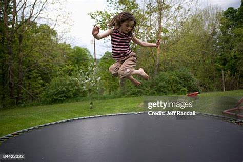 Girls Jumping On Trampolines Photos And Premium High Res Pictures