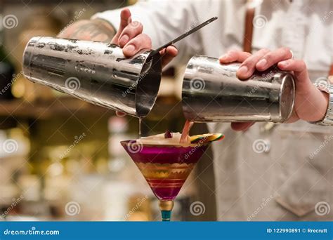 Professional Bartender Pouring An Alcohol From The Measuring Cup