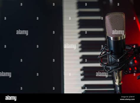Synthesizer Midi Keyboard And Microphone On A Black Background Close Up Recording Studio Synthesizer Midi Keyboard And Microphone On A Black Background Close Up Recording Studio