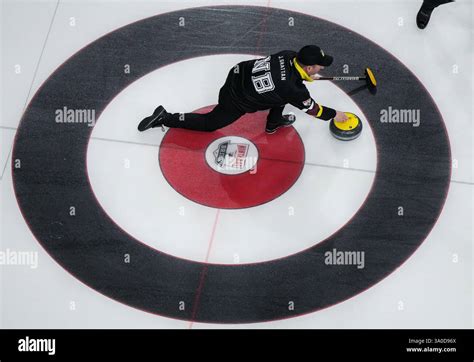 New Brunswick Skip James Grattan Delivers A Rock While Playing Manitoba
