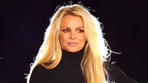 Britney Spears Covers Herself As She Dances Erratically In Revealing