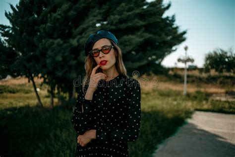 Beautiful Girl In Vintage Polka Dot Dress Posing For The Photographer Stock Photo Image Of
