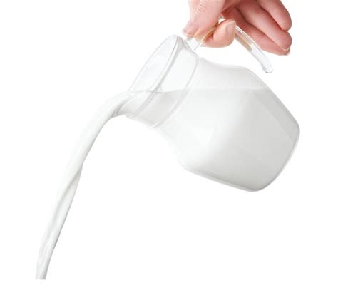 Premium Photo Milk From Jug Pouring Isolated On White Background