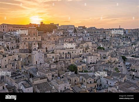 View Over The Sassi Di Matera Complex Of Cave Dwellings At Sunset In