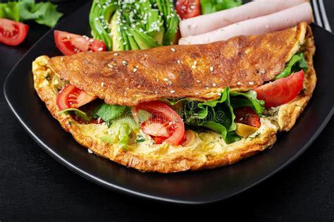 Keto Breakfast Omelette Tomato Olives And Avocado Ham Ketogenic