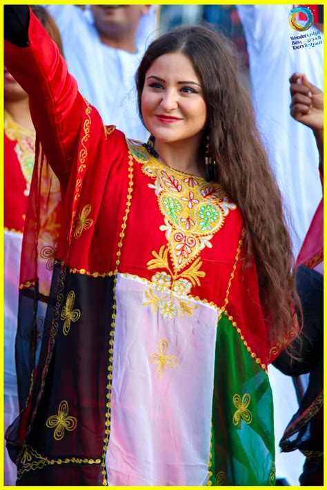 Girl Waves At The Thunderous Cheers Of Joy At The Uae National Day