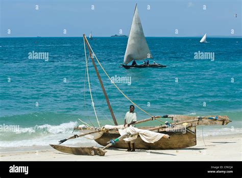 Fishermen With Their Ngalawa A Traditional Double Outrigger Canoe