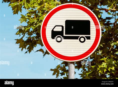 Red And White Round Traffic Sign With Black Cargo Truck Indicating No