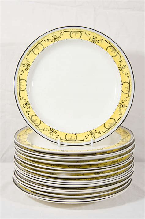 Twelve Creamware Dinner Plates With Yellow Neoclassical Borders Made