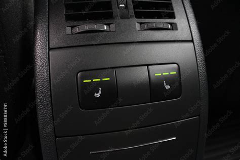Foto De Stock Switch To Activate The Heater In The Car Seats Adobe Stock