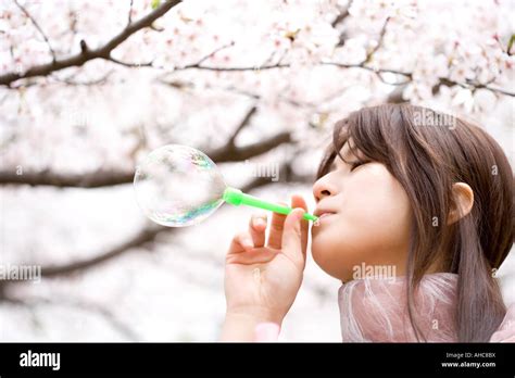 Woman Under The Cherry Tree Stock Photo Alamy