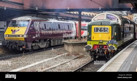 Class 91 Electric Train 91101 Flying Scotsman Stands Beside Preserved