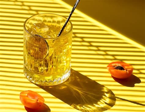 Premium Photo Refreshing Cooling Apricot Summer Drink With Ice Cubes